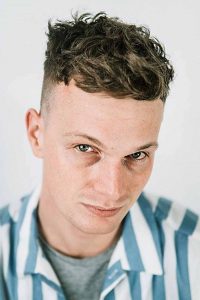 Unleashing timeless elegance: Caesar cut for men with curly hair 18 ...