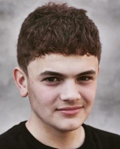 Unleashing timeless elegance: Caesar cut for men with curly hair 18 ...